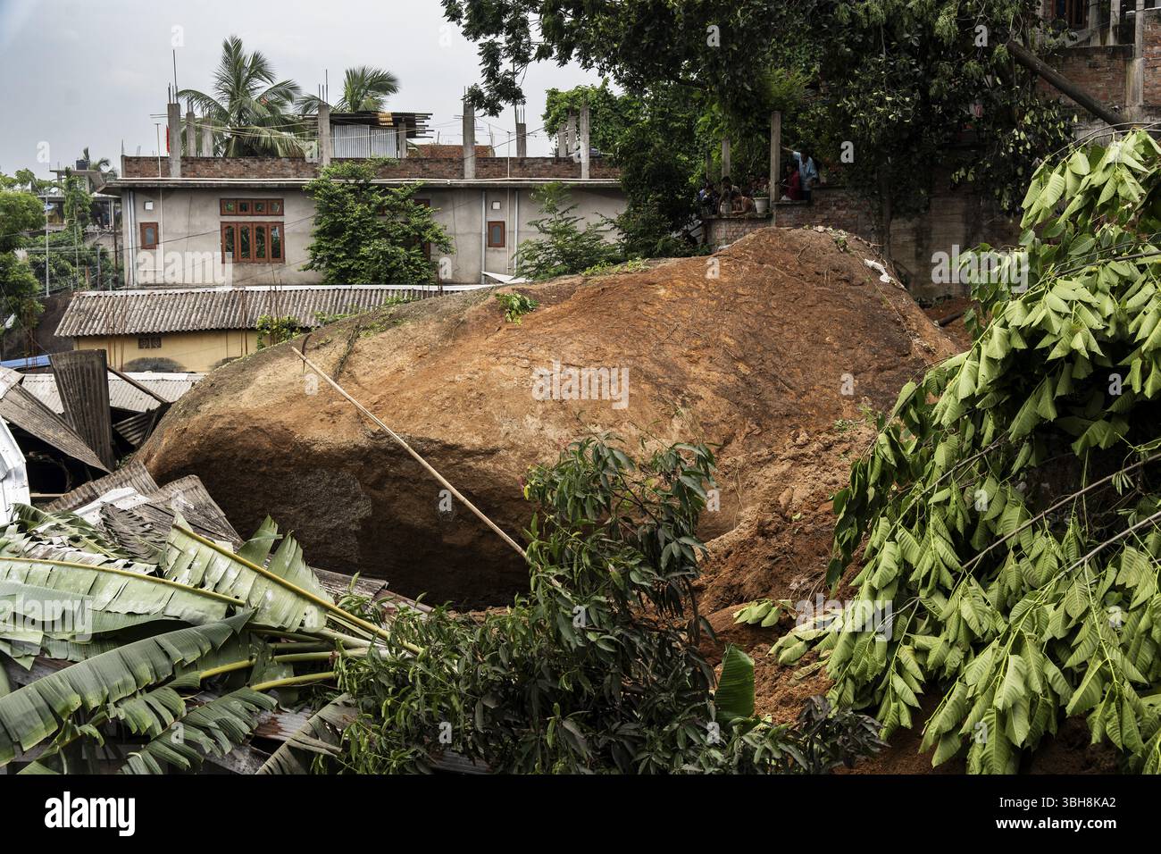 Large rock slides from the top of a hill and damaged houses in a major ...