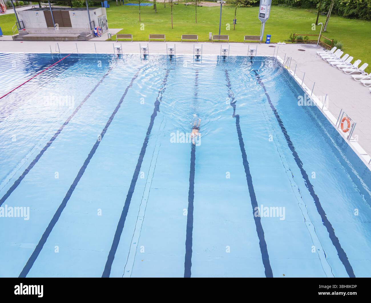 A swimmer swimming his laps in a large, empty swimming pool, Calw ...