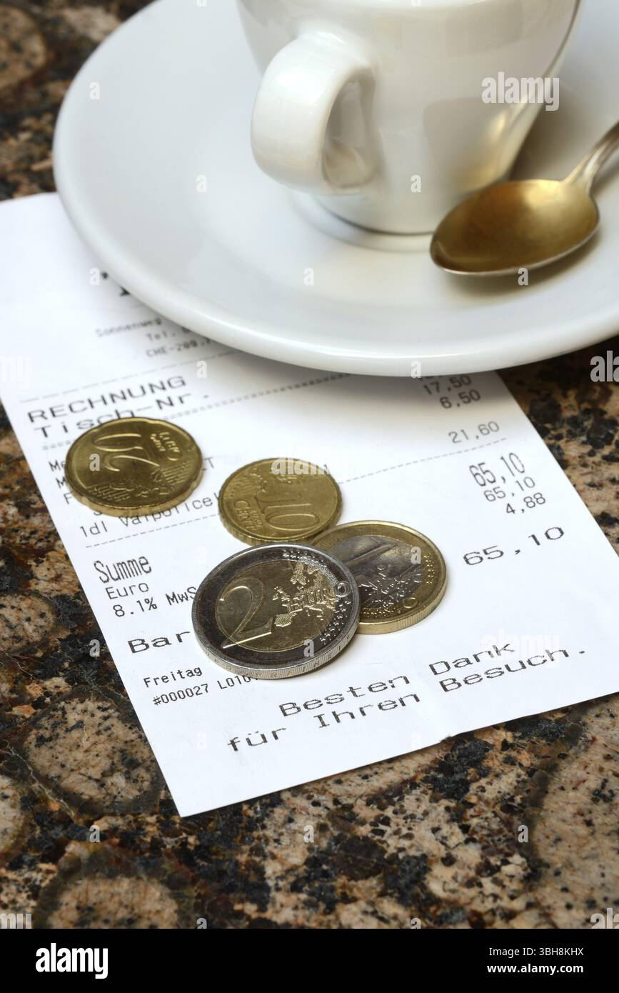Tip, euro coins with receipt Stock Photo - Alamy