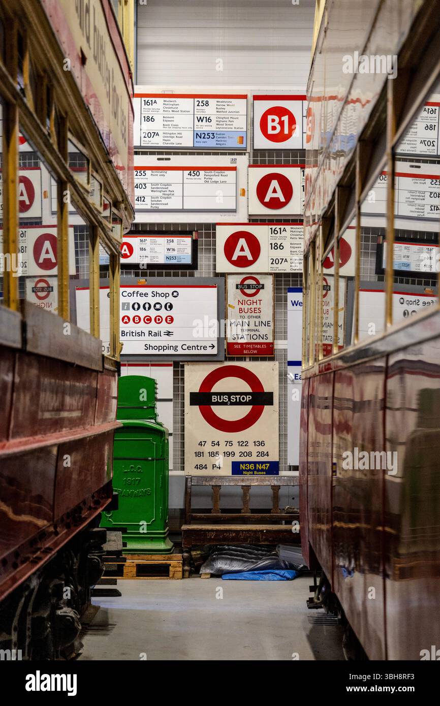 Collection of bus signage between two tram cars at the London Transport ...
