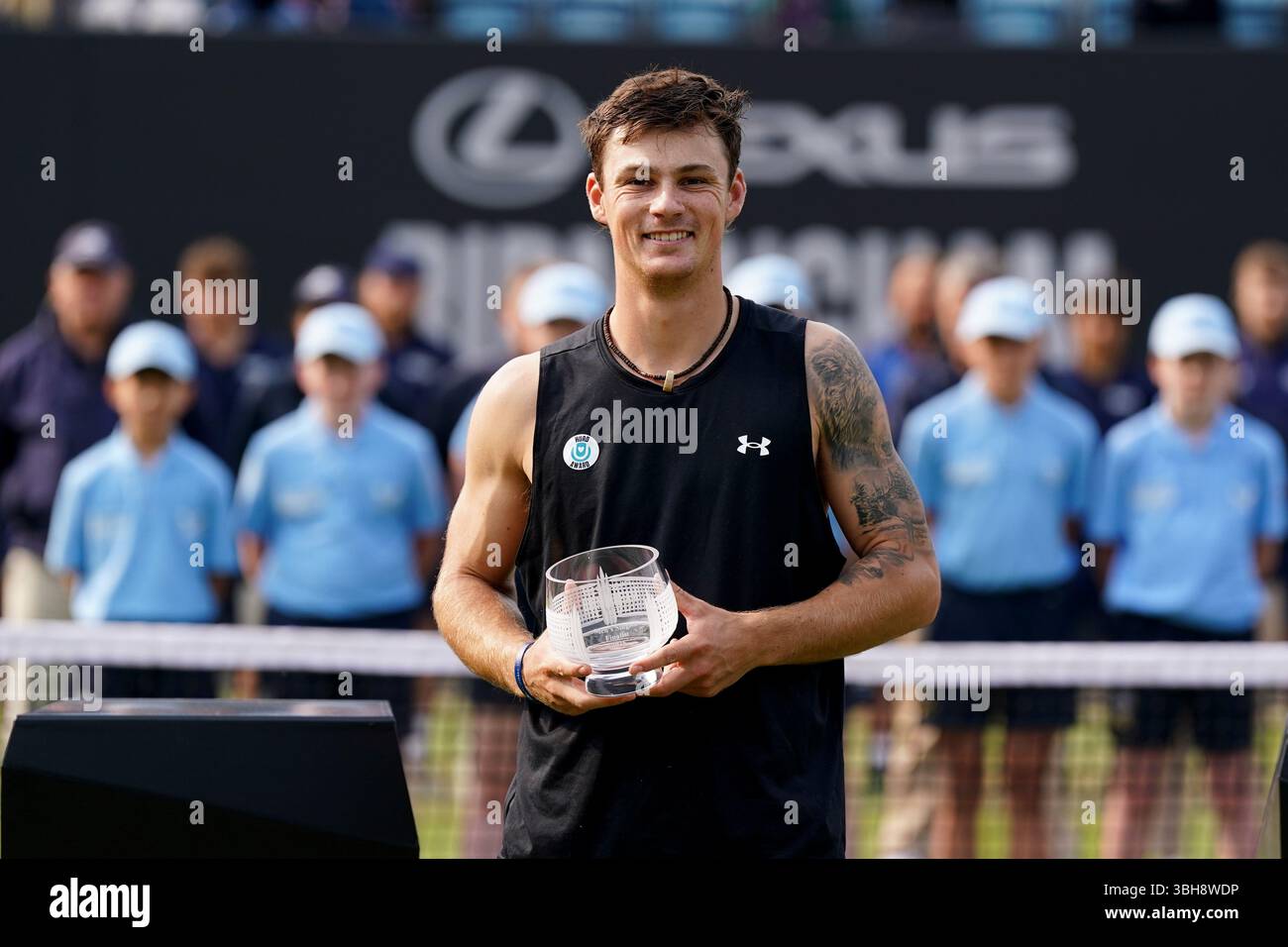 Colton Smith with the Runners up trophy after the Men's Final on day ...