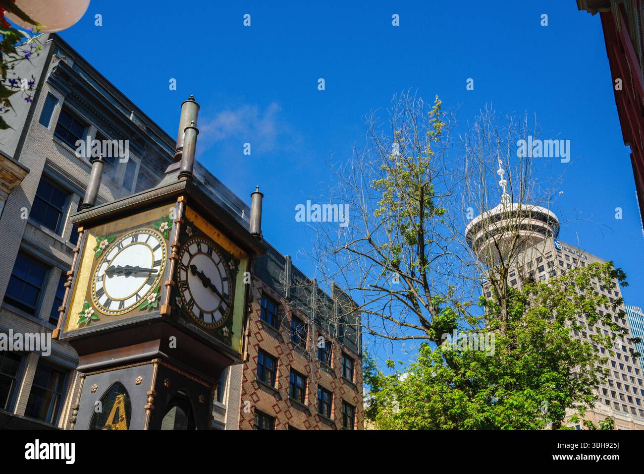 The Gastown Steam Clock with the Vancouver Lookout tower overhead along ...
