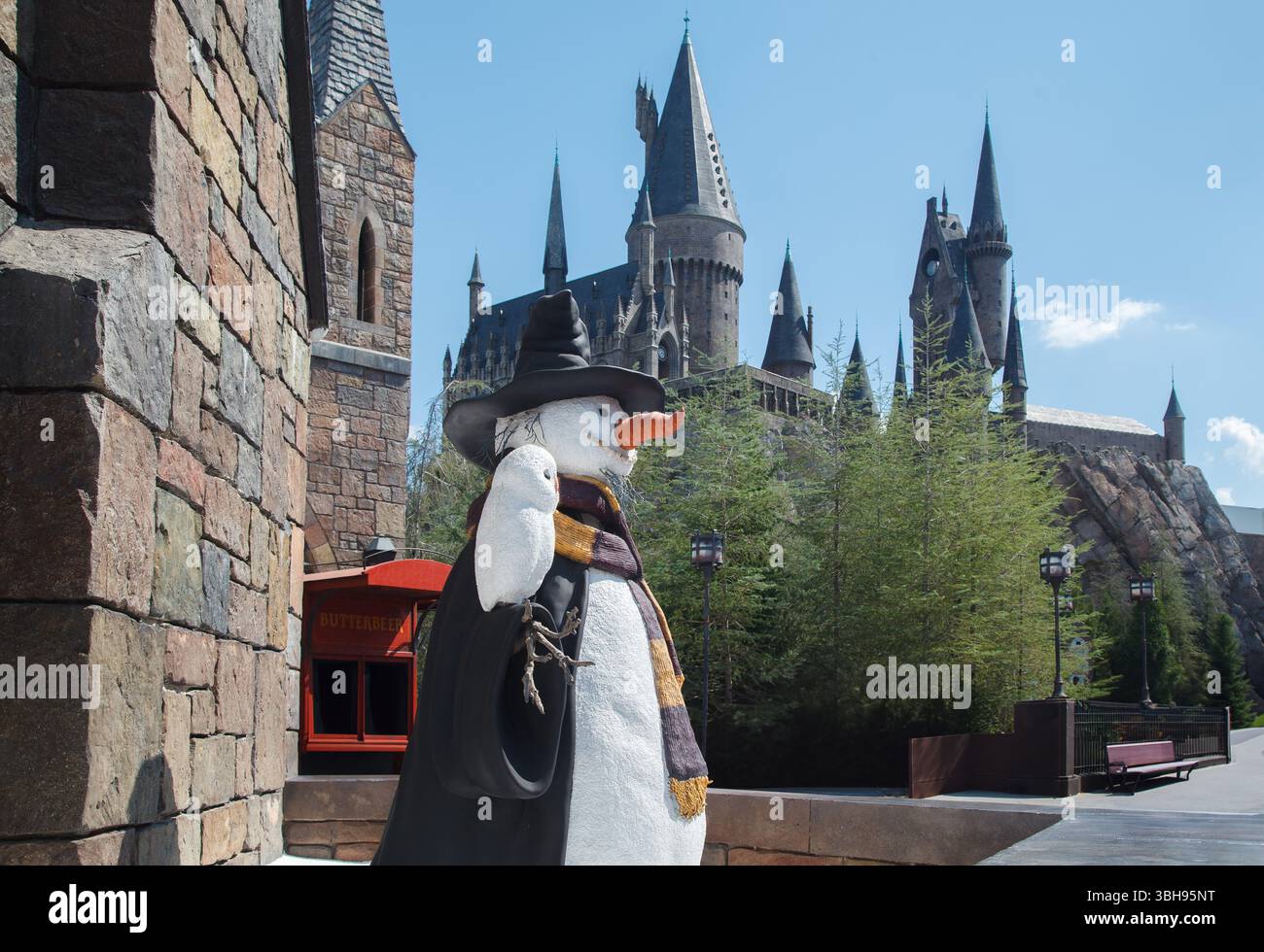 A Penguin wizard with an Owl and Hogwarts ride at Wizarding World of ...