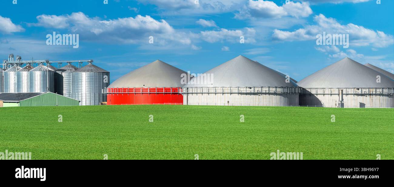 Agricultural biogas plant behind a wheat field in springtime Stock ...