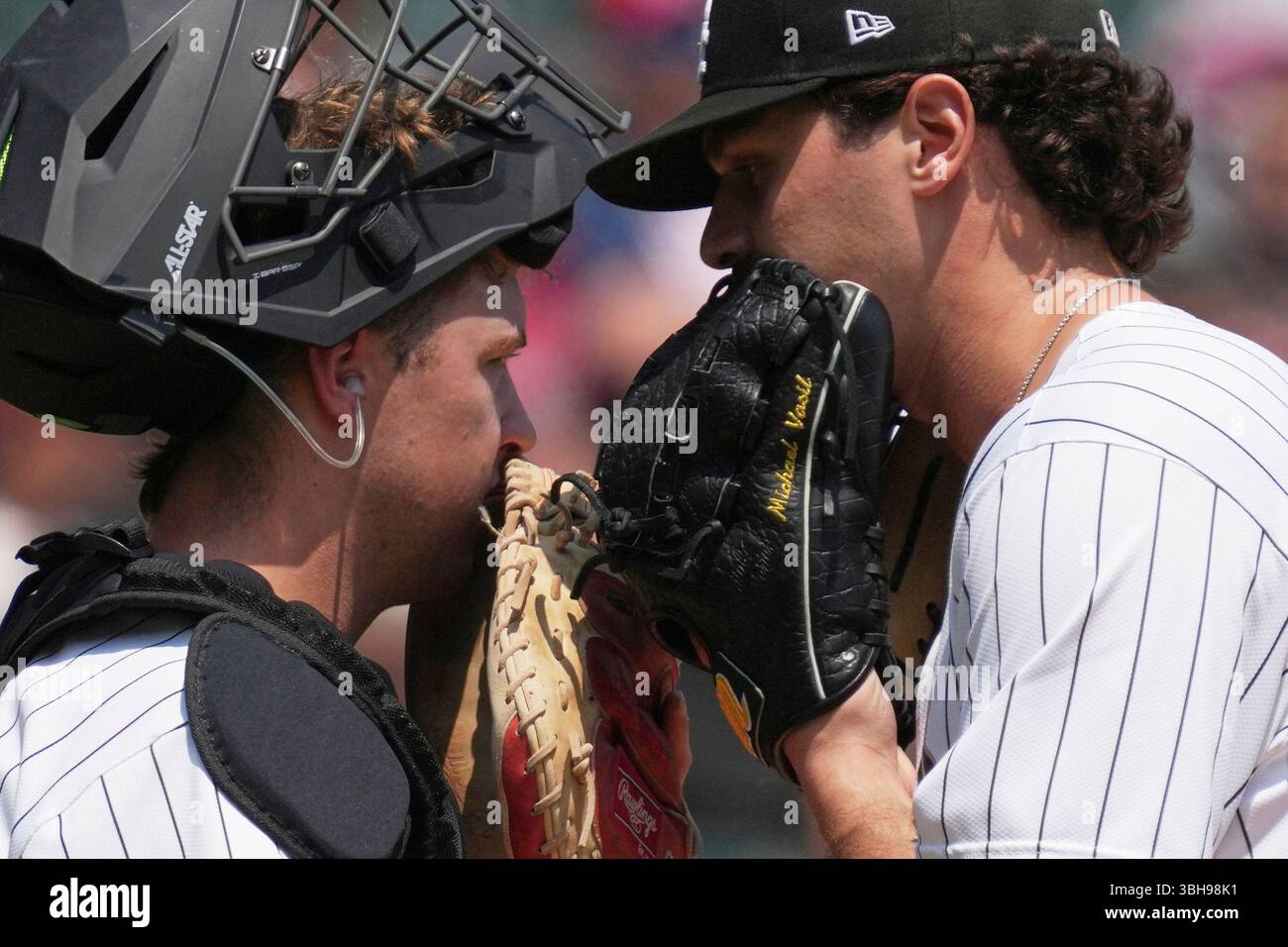 Chicago White Sox catcher Kyle Teel, left, talks with starting pitcher ...