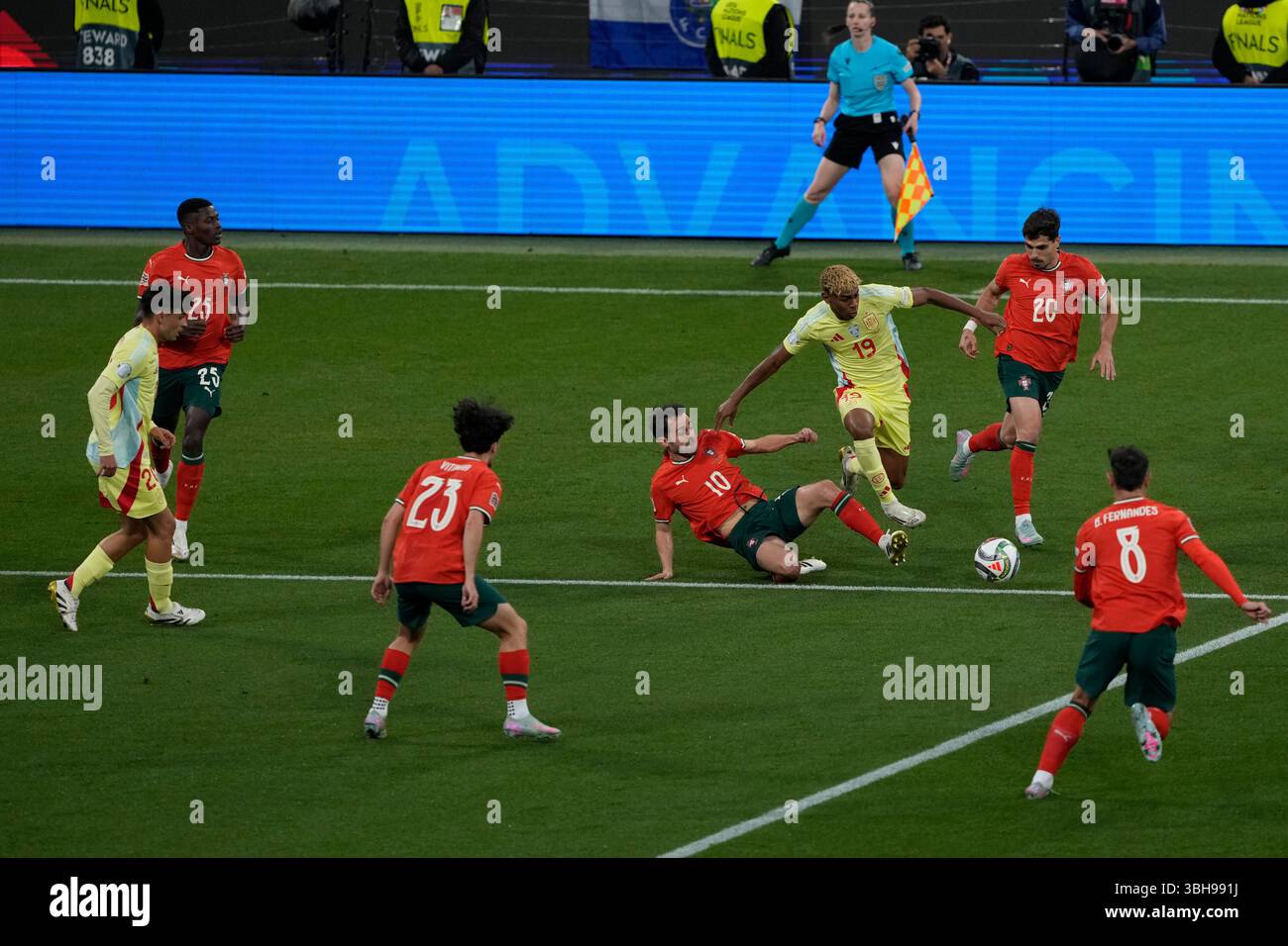 Spain's Lamine Yamal (19) and Portugal's Bernardo Silva fight for the ...