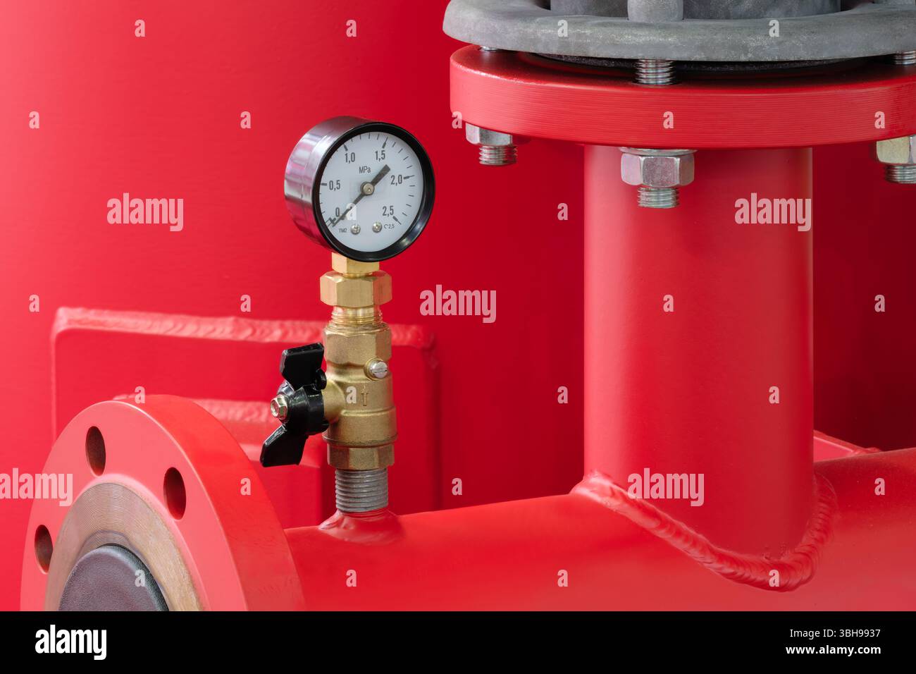 Stainless steel pipe with a white pressure gauge on it as part of a fire protection system Stock ...
