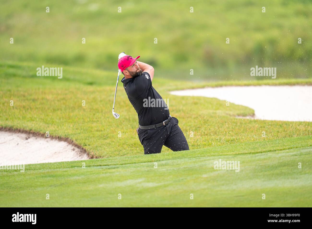Captain Jon Rahm of Legion XIII hits his shot from the 14th fairway ...