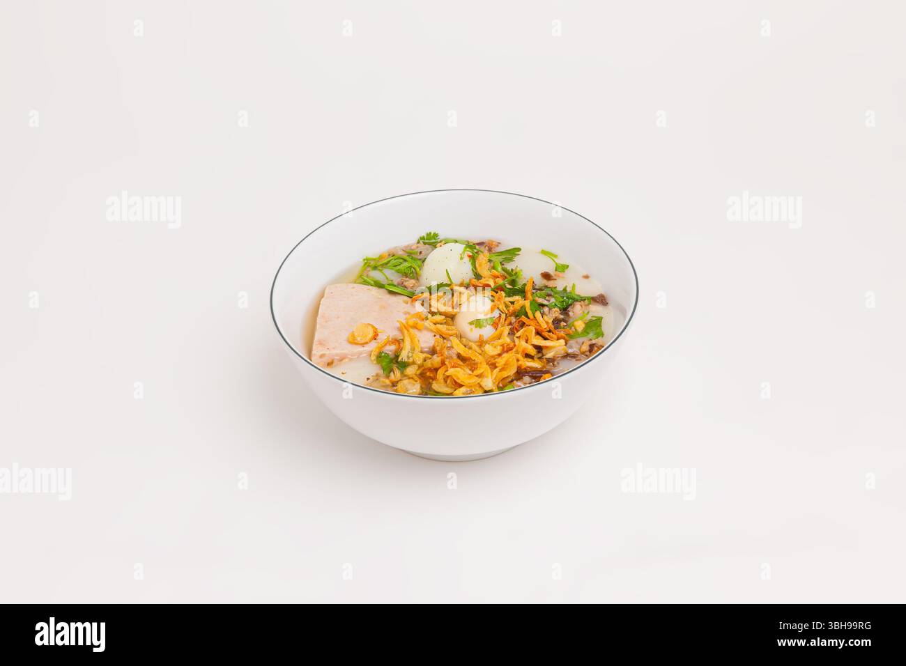 A bowl of Banh Duc, a traditional Vietnamese steamed rice cake with ...