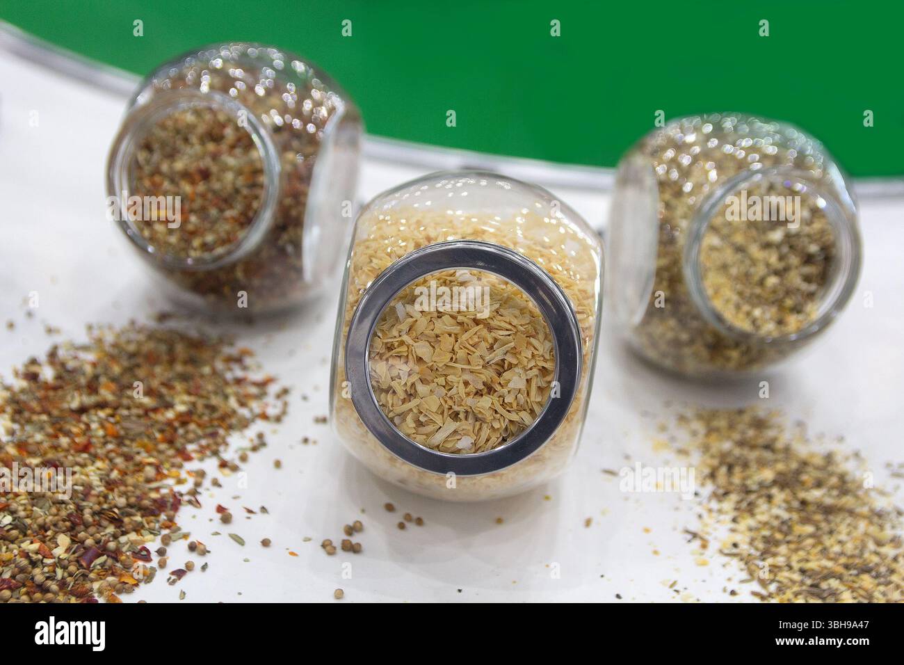 Samples of food additives in glass jars in a showcase. Food industry ...