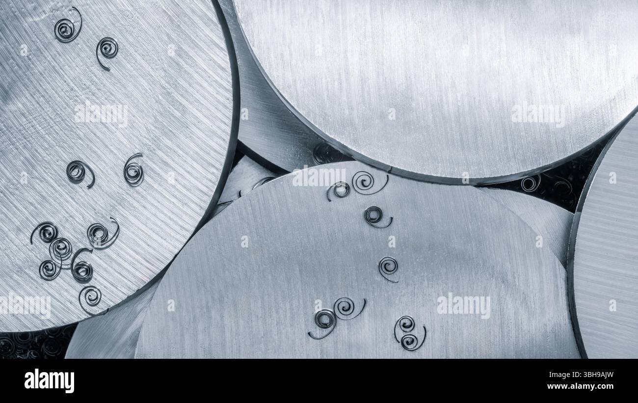 Metal disks sawn by modern disk machine with shavings on the surface as ...