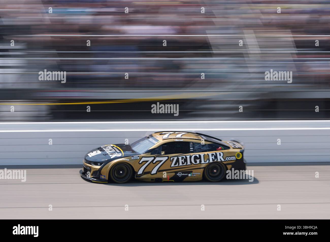 Carson Hocevar (77) drives during a NASCAR Cup Series auto race at ...