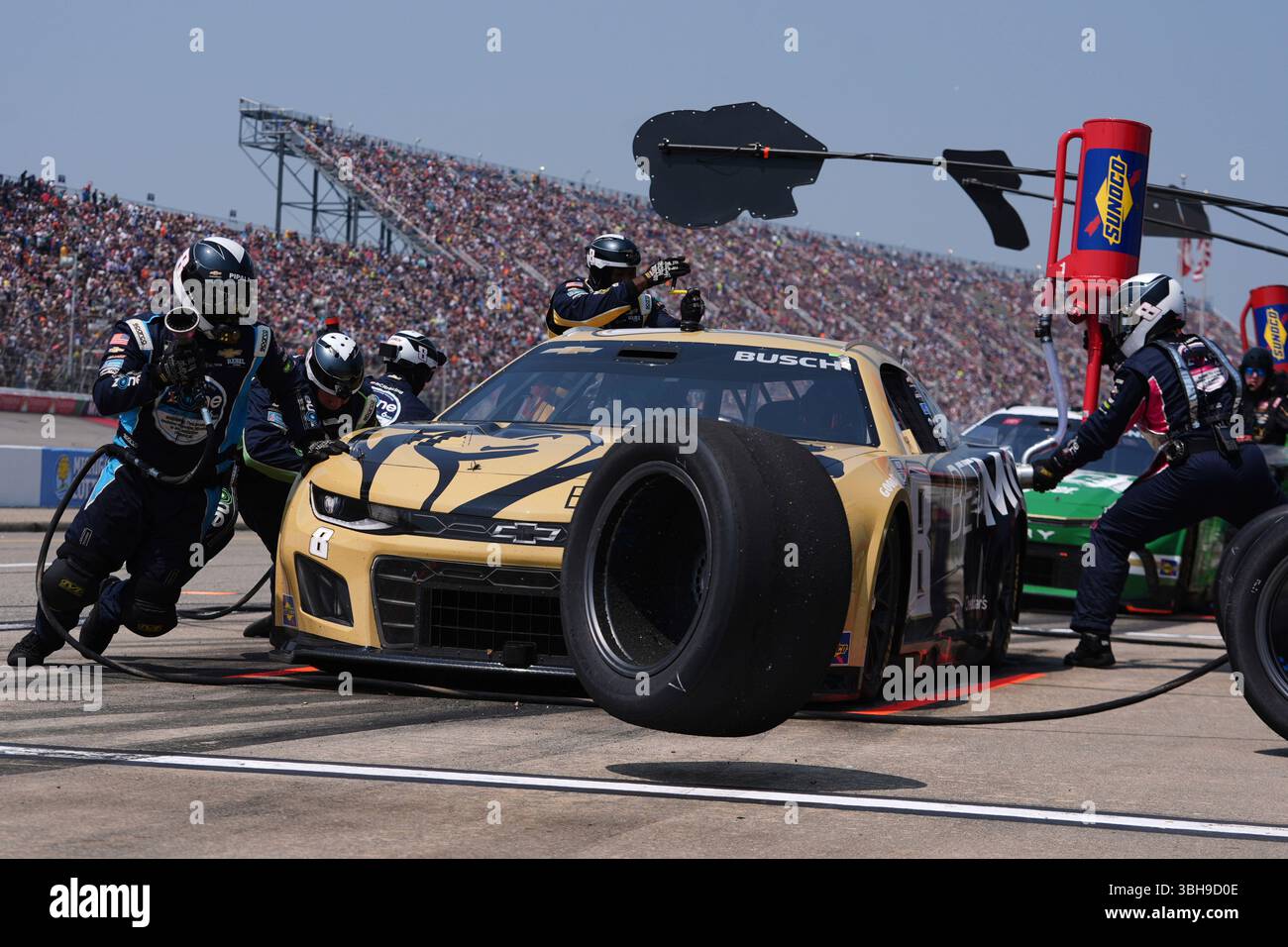 Kyle Busch's crew performs a pit stop during a NASCAR Cup Series auto ...