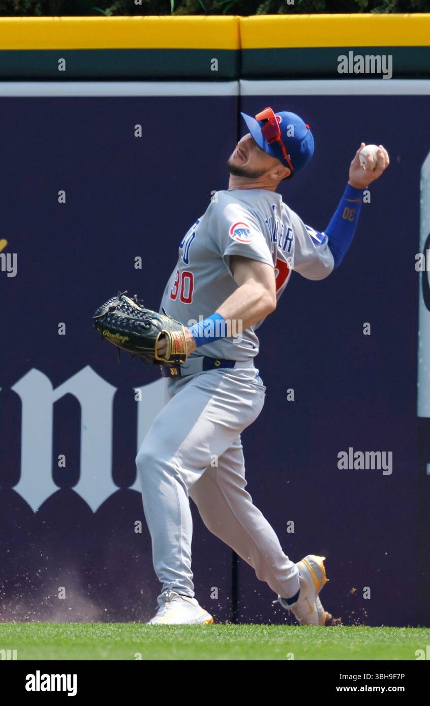 Chicago Cubs right fielder Kyle Tucker throws to second base on a ...