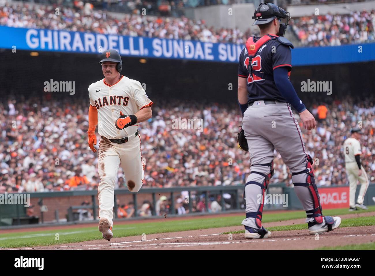 San Francisco Giants' Matt Chapman, left, runs home to score next to ...
