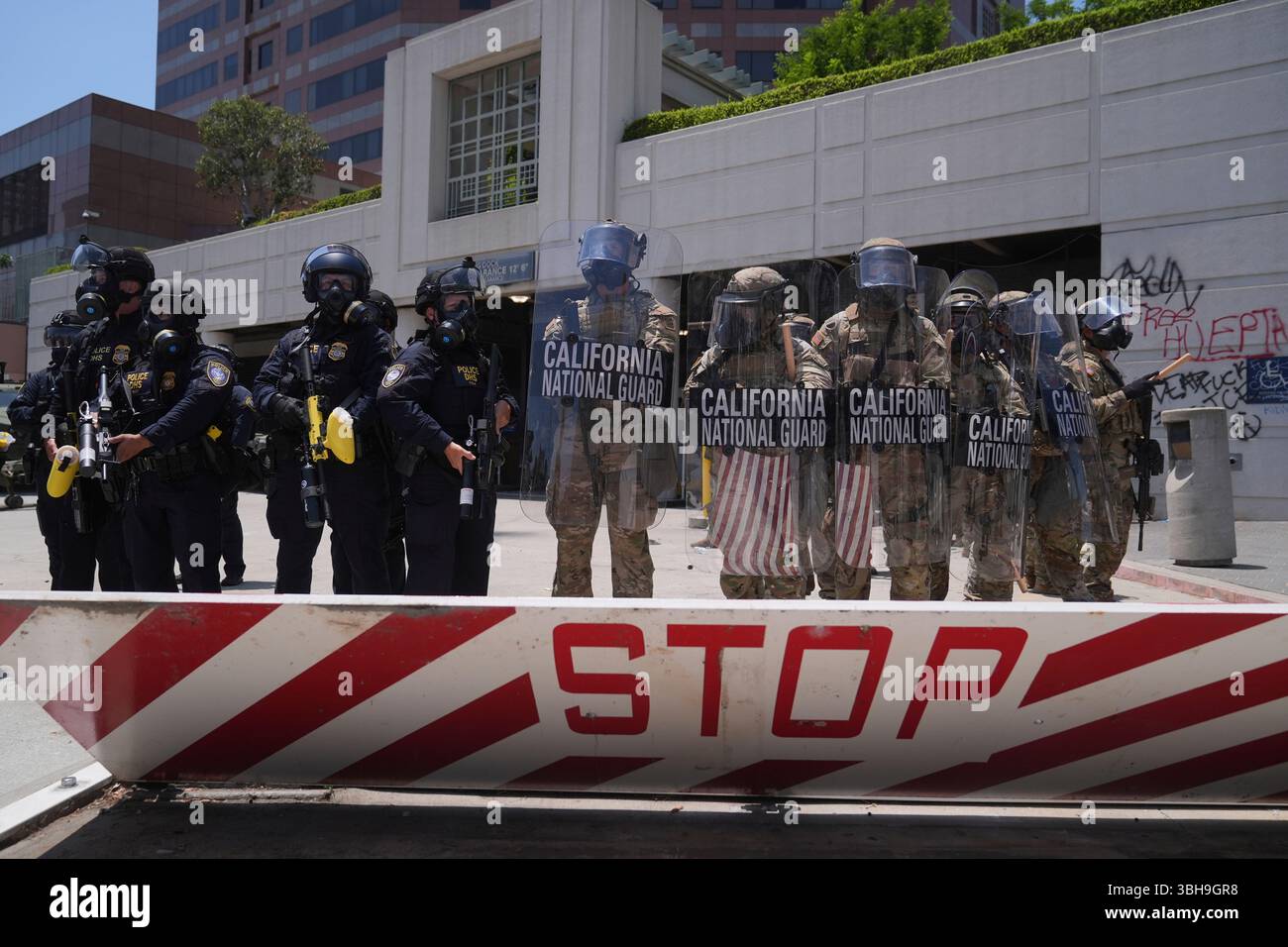 Authorities stand guard outside at the metropolitan detention center in ...