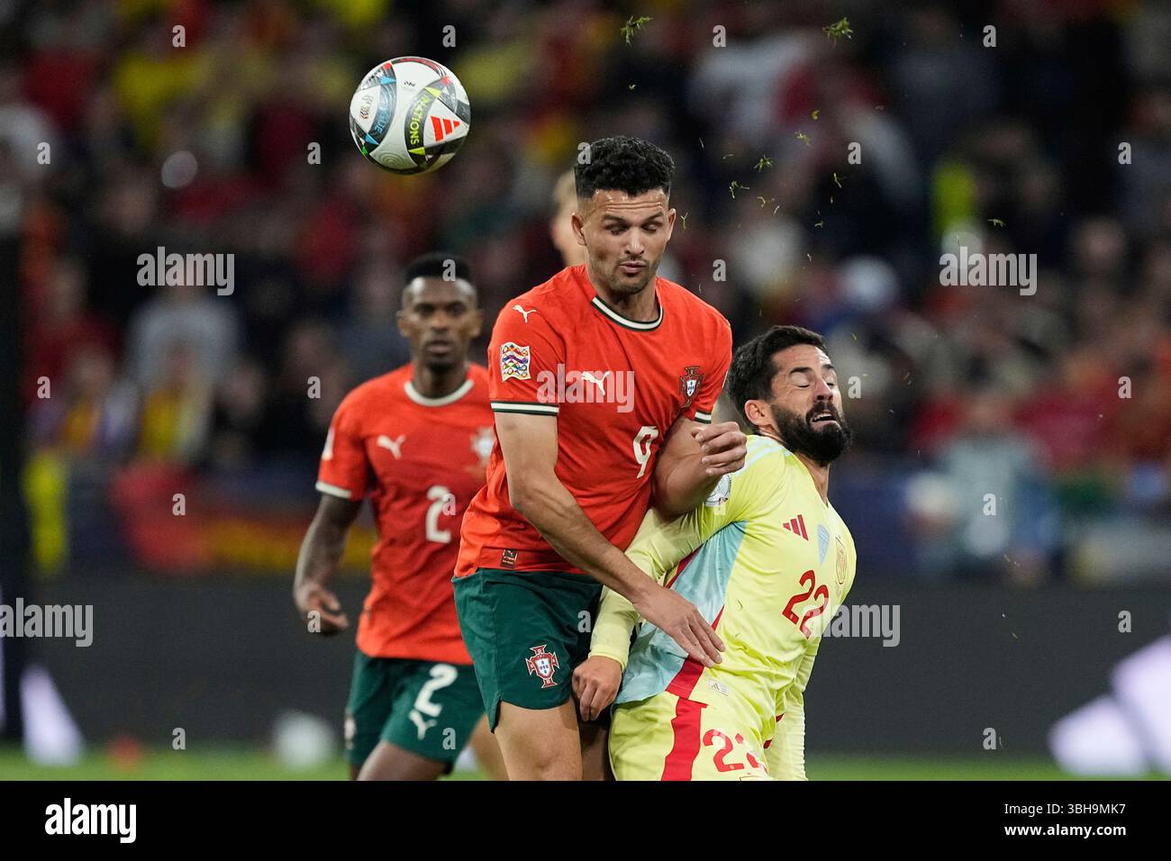Portugal's Goncalo Ramos, left, and Spain's Isco battle for the ball ...