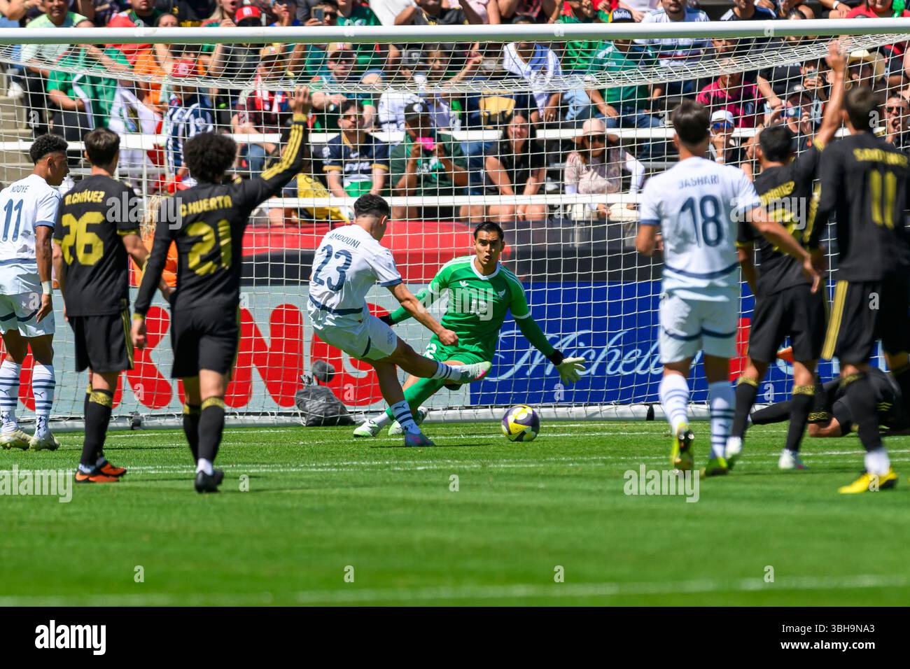 Switzerland's Zeki Amdouni (23) shoots the ball towards a diving José ...
