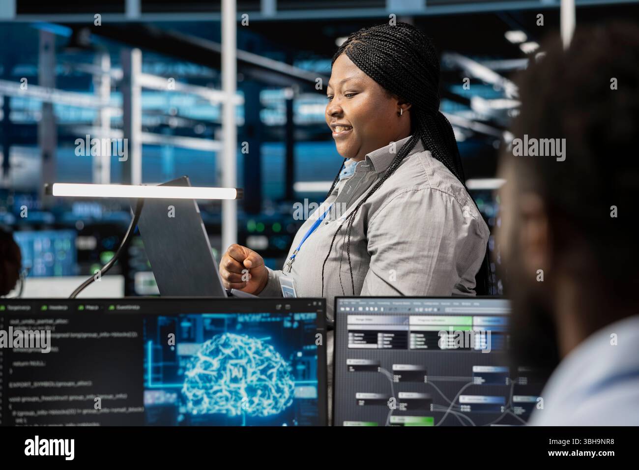 Smiling server room developer using artificial intelligence to enhance ...