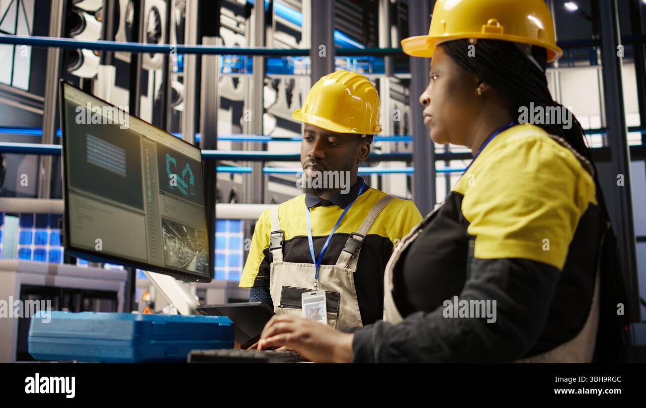 Smart factory manager overseeing work hi-res stock photography and ...