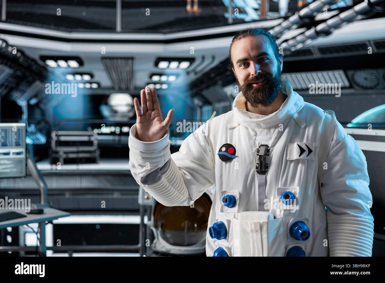 Astronaut waves hand during video call with command center on Earth ...