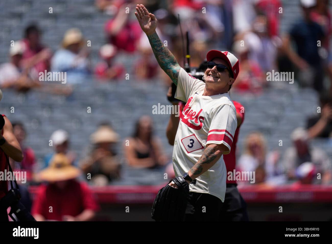 Tré Cool, drummer for the rock band Green Day, gestures after throwing ...