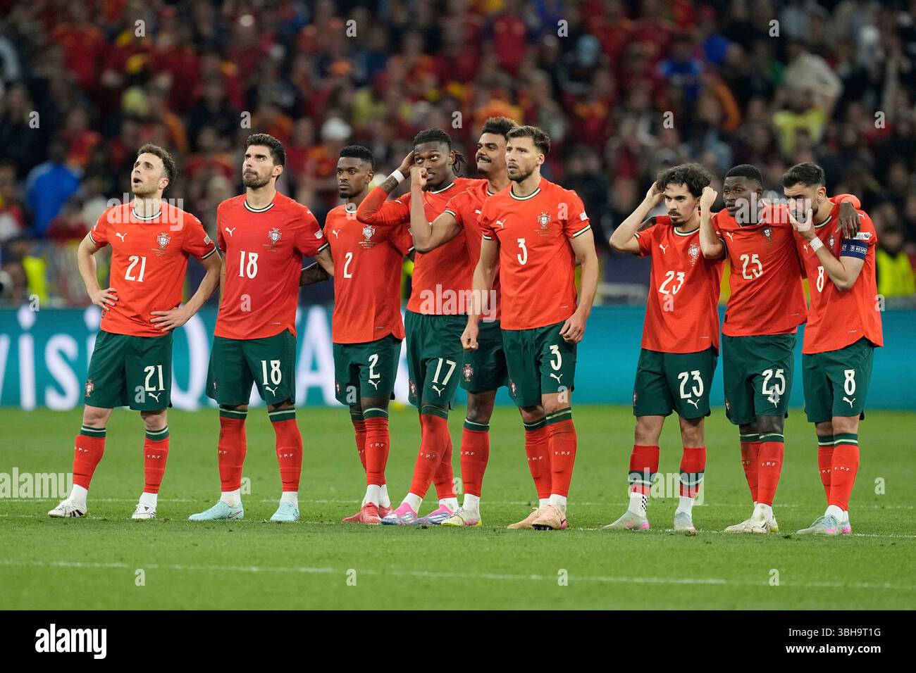 Portugal players stand together in a penalty shootout during the ...