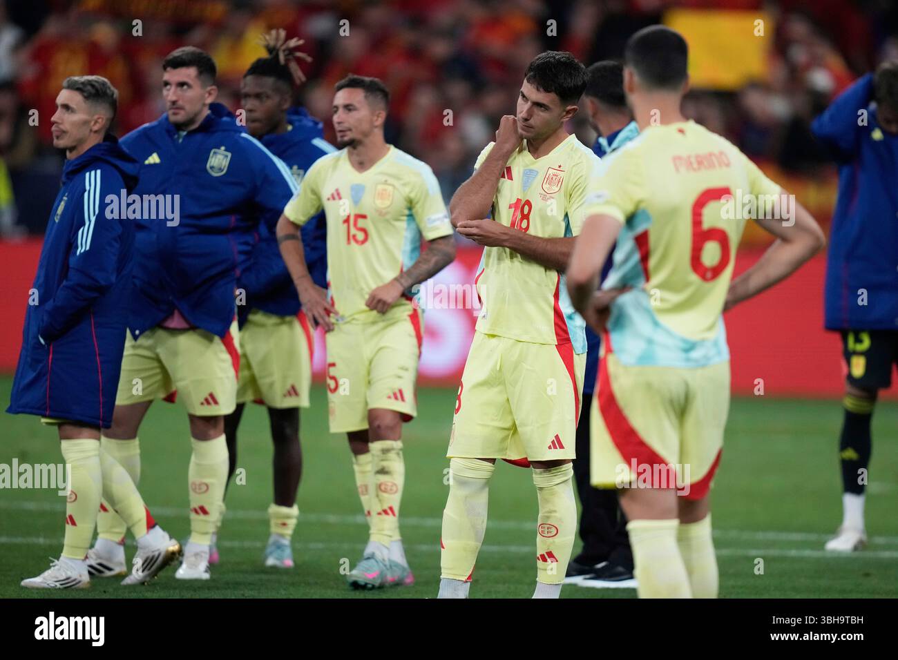 Spain's players stand on the pitch after the Nations League final ...