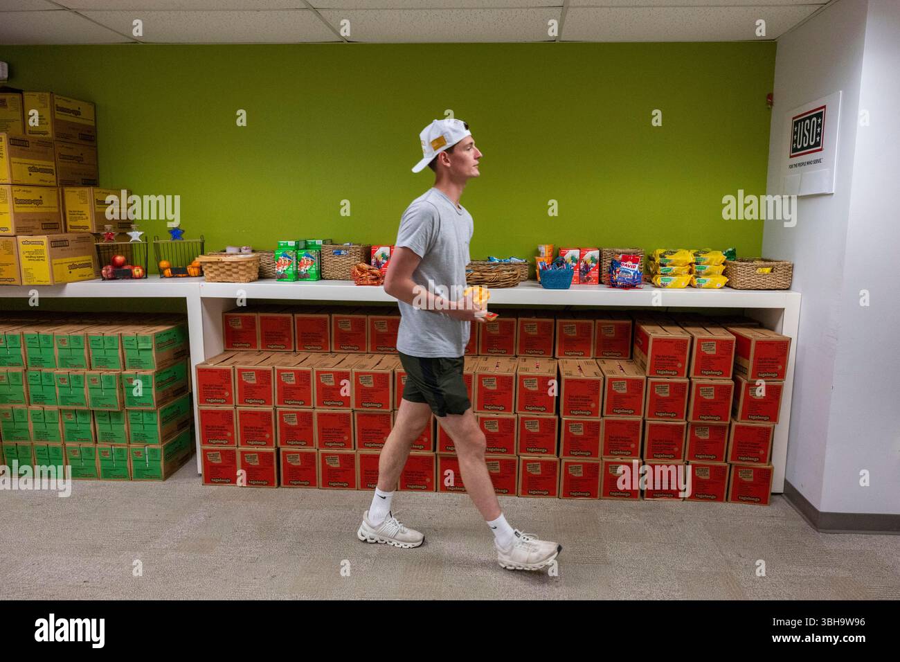 A young Army soldier grabs some snacks in the USO that has been set up ...