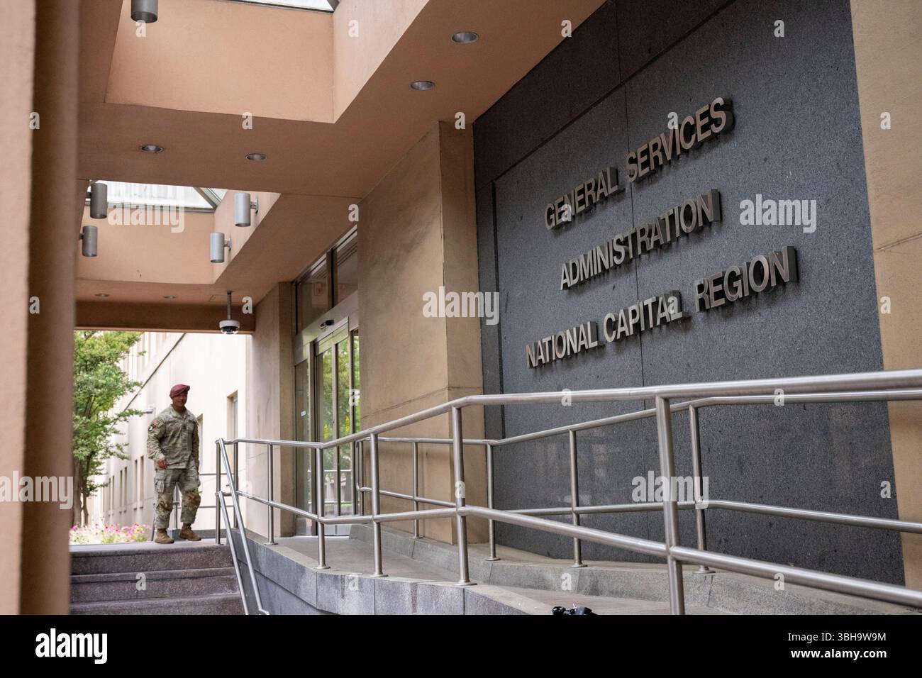 A soldier walks into the GSA Regional Office Building that will house ...