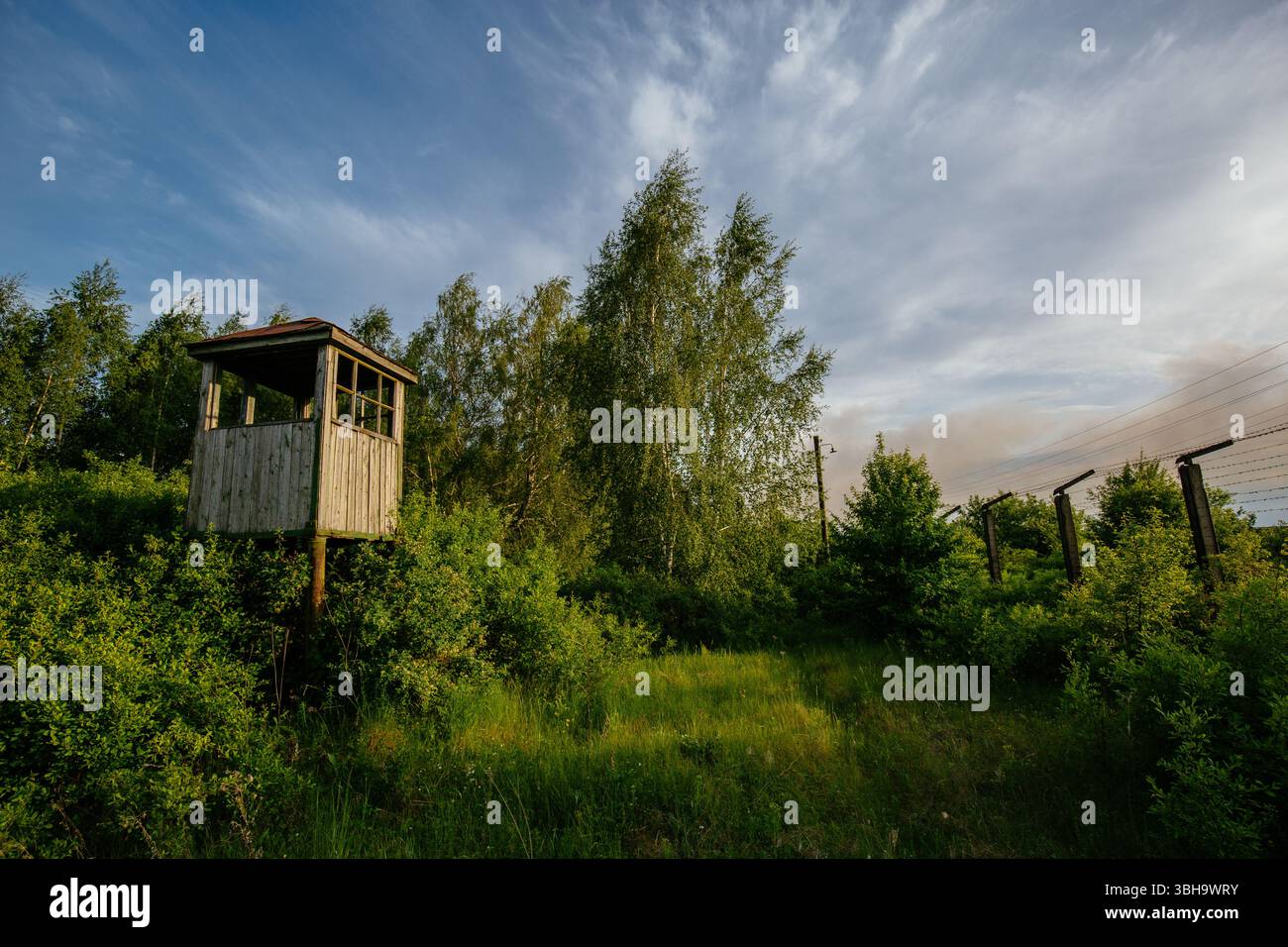 Old observation tower in abandoned overgrown Soviet Russian prison ...