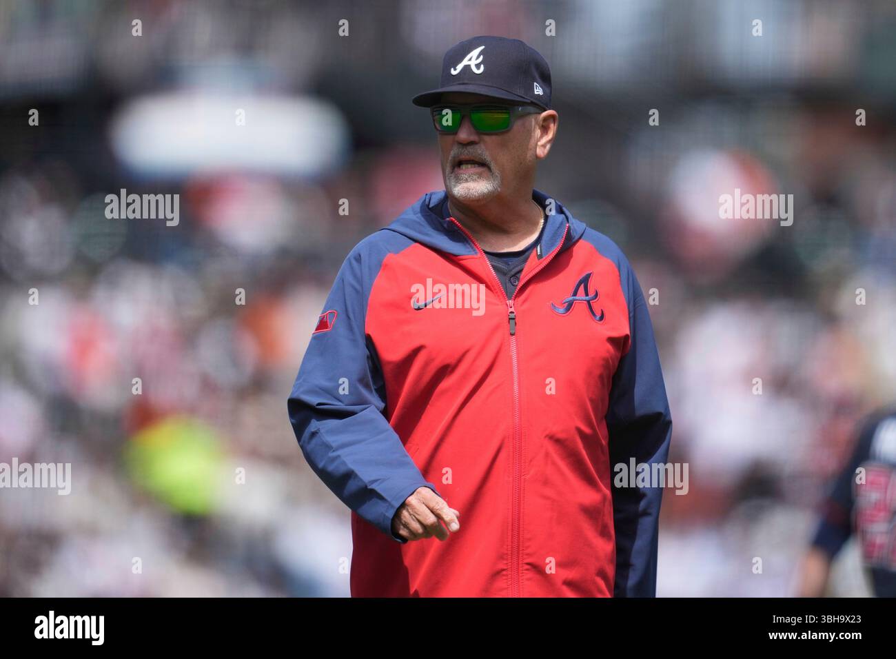 Atlanta Braves manager Brian Snitker walks to the dugout after making a ...