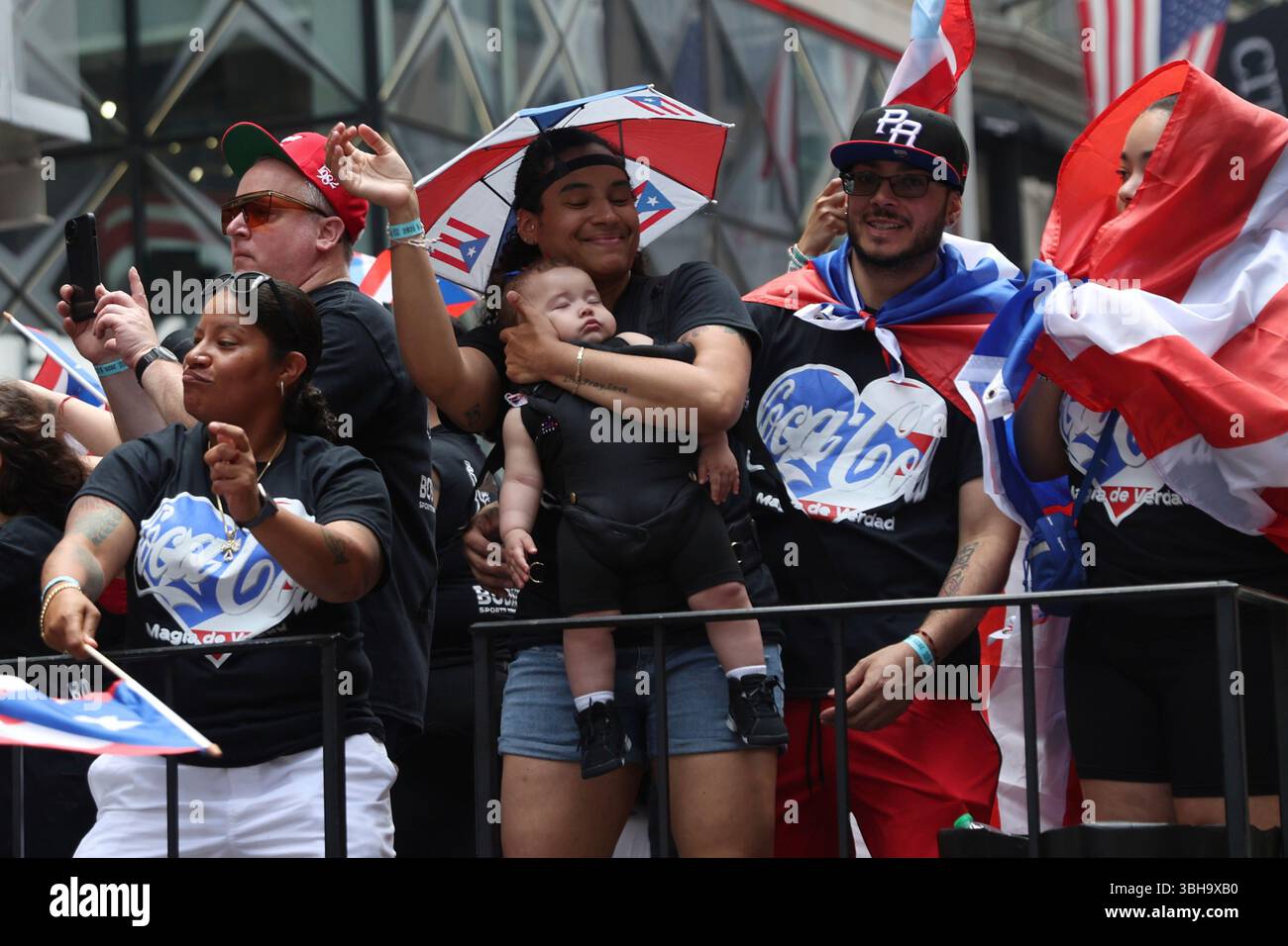 Performers dance on a float as they make their way down Fifth Avenue during the Puerto Rican Day ...