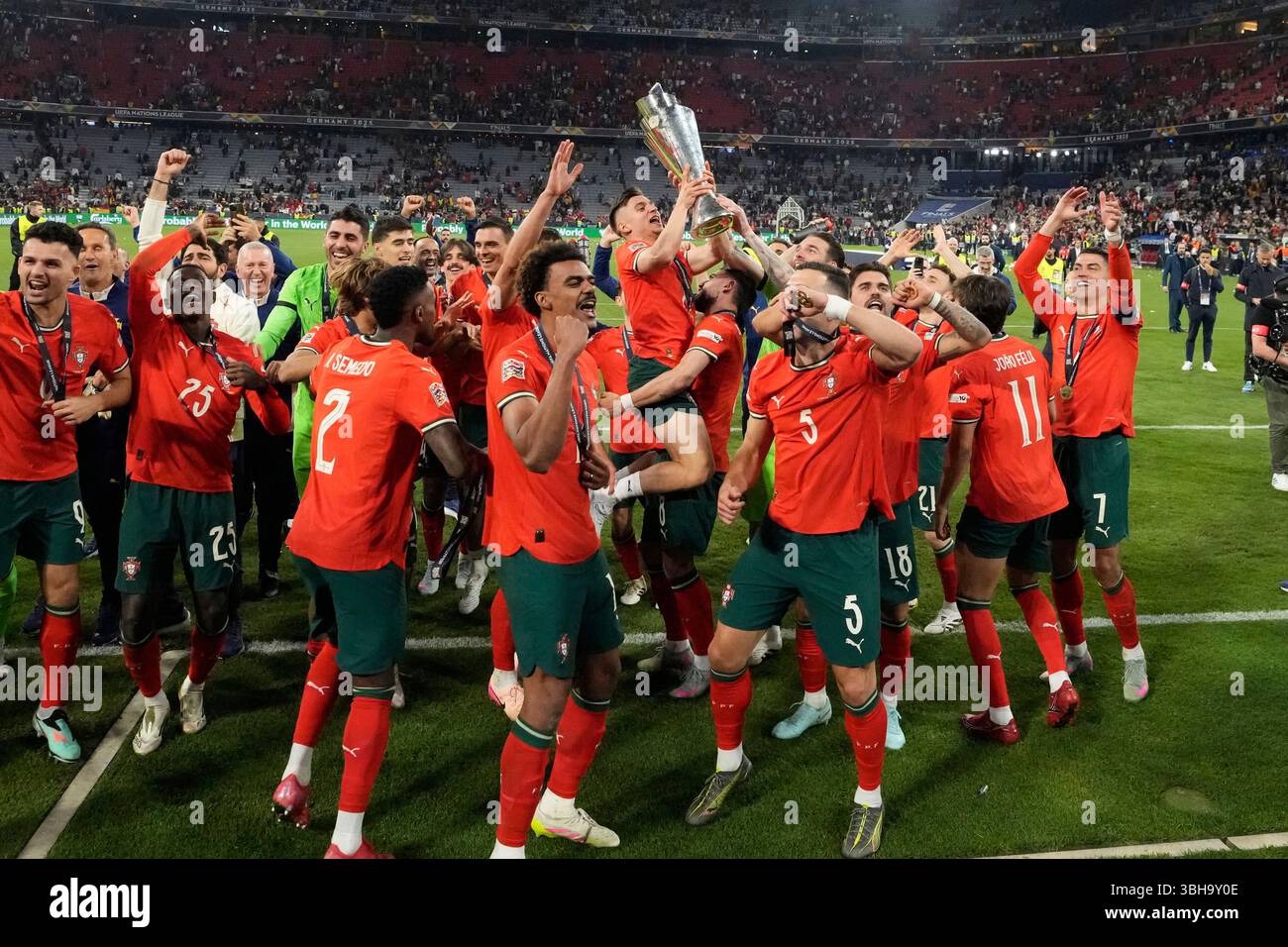 Portugal's players celebrate with the trophy after winning the Nations ...