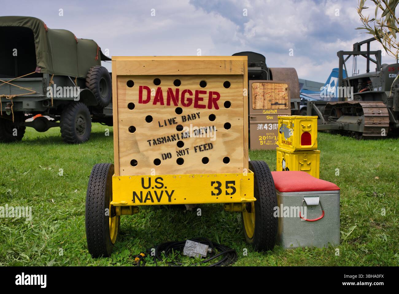A yellow and wooden U.S. Navy crate, marked "DANGER," "LIVE BABY ...