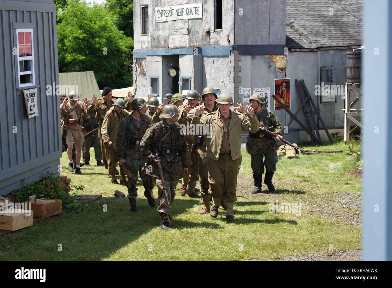 A group of men in WWII-era military uniforms, some German and some ...