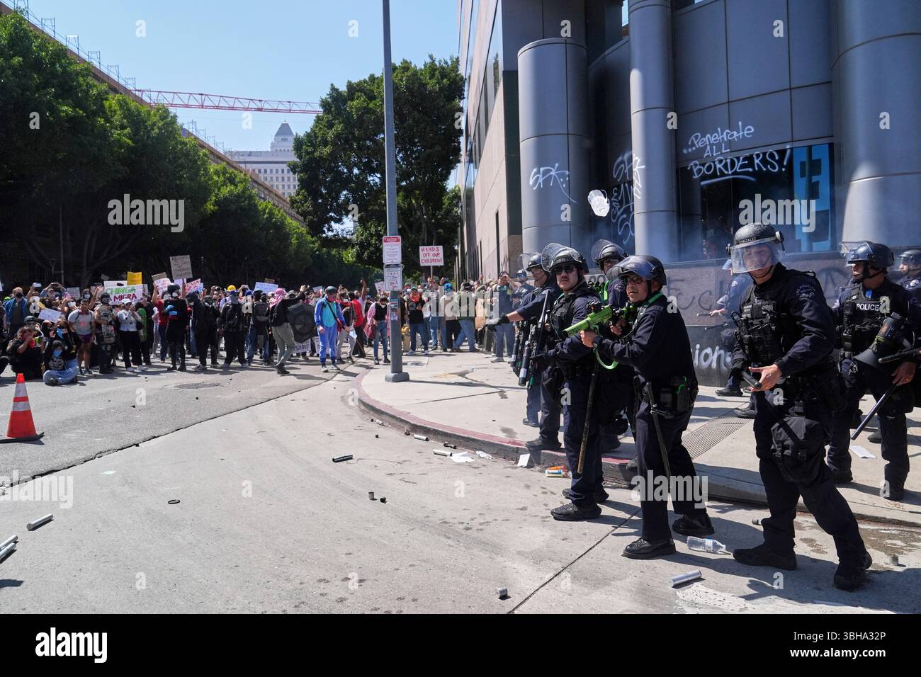 Protesters confront a line of police outside the metropolitan detention ...