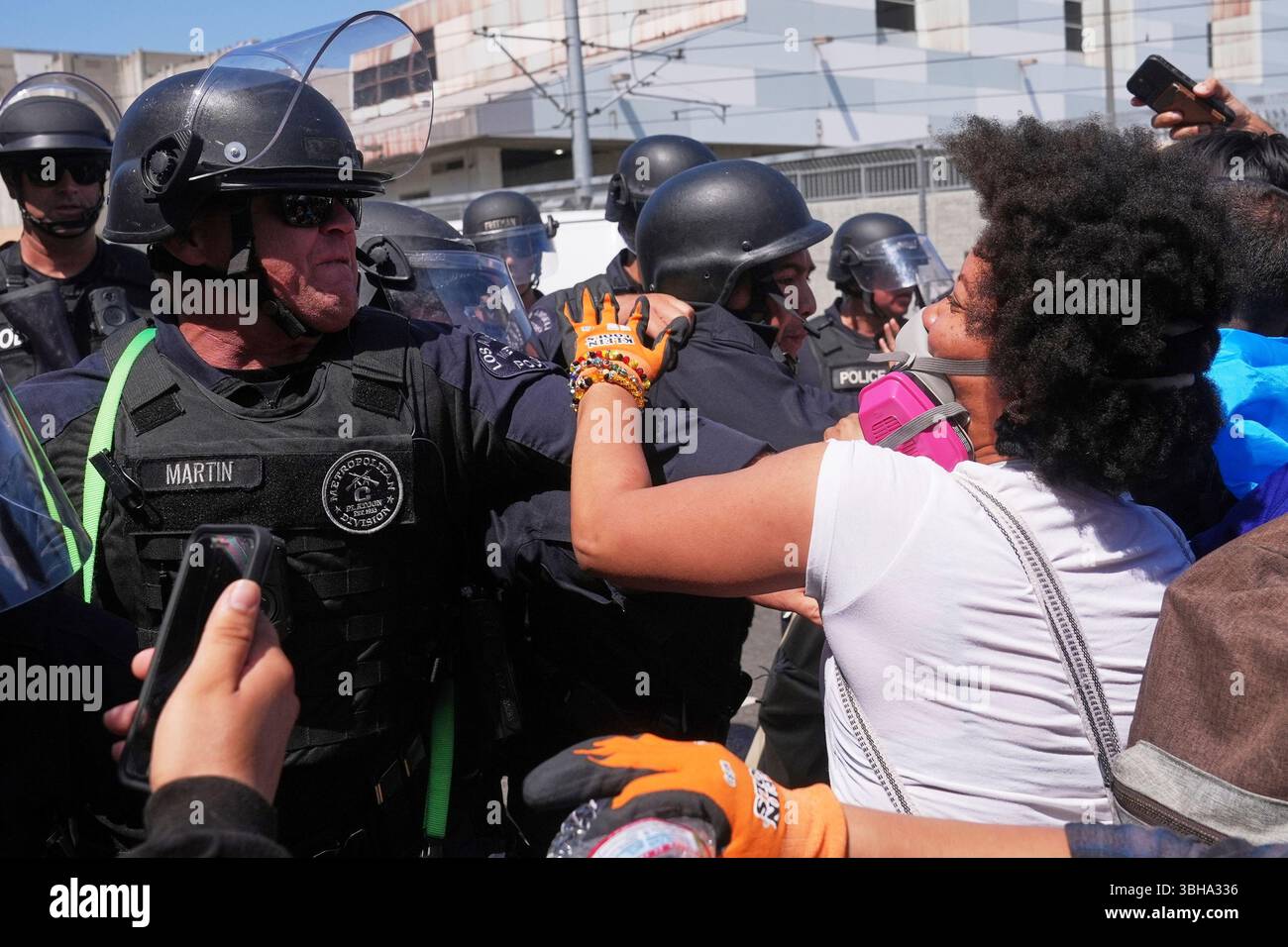 Protesters confront a line of police near the metropolitan detention ...