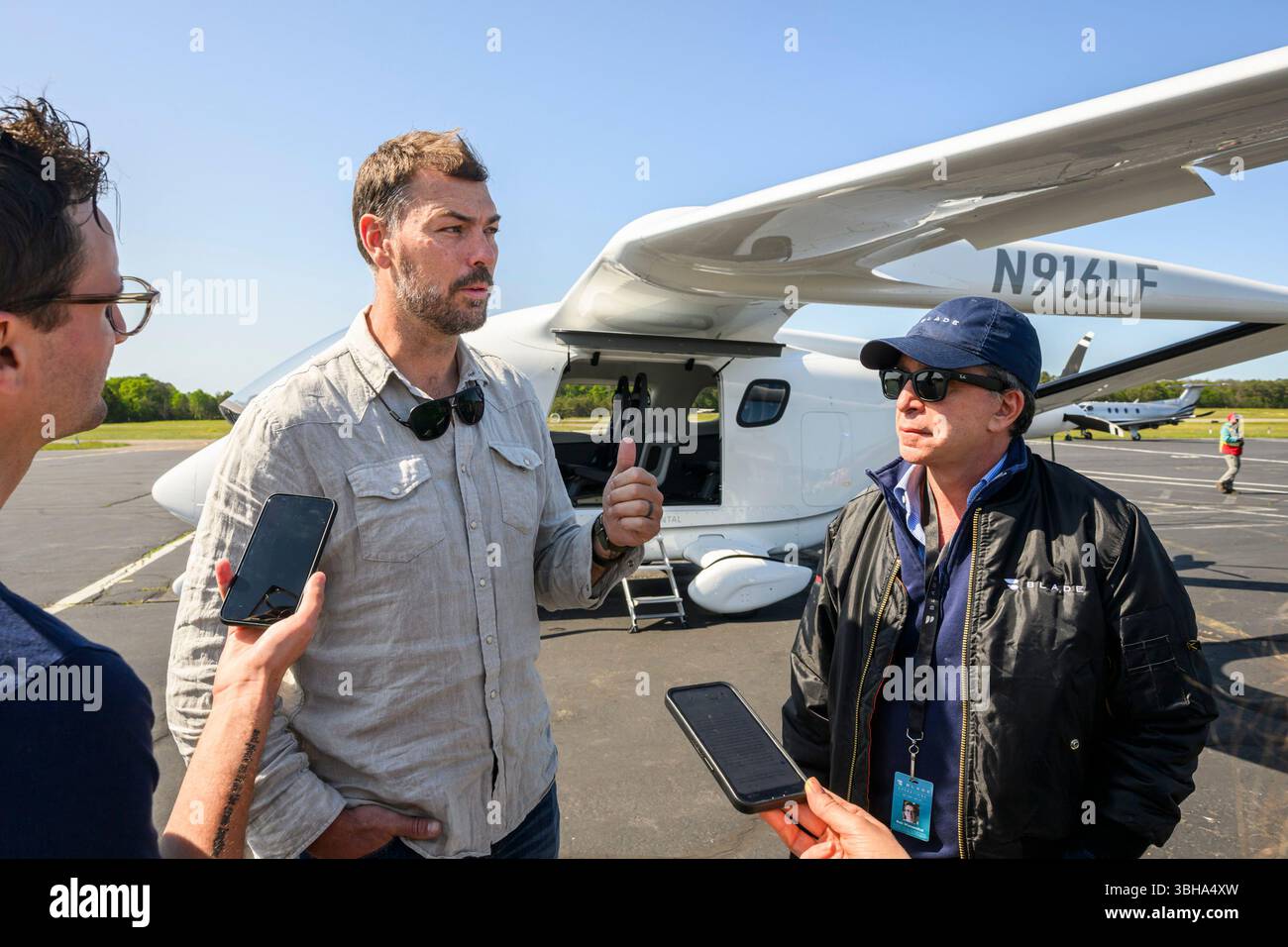 BETA Technologies CEO and founder Kyle Clark, left, and Blade CEO Rob Wiesenthal, right, speak ...