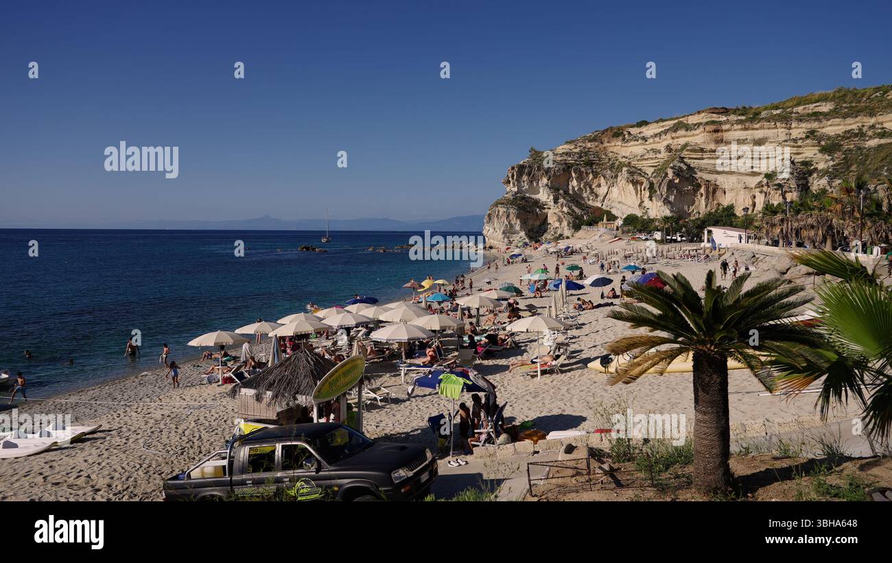 CAPO VATICANO, ITALY - JUNE 2, 2025 - Tourists relaxing on the beach at ...