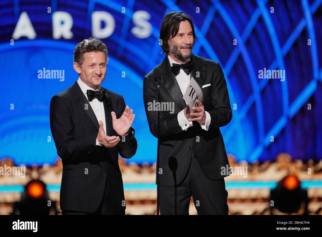 Alex Winters, left, and Keanu Reeves present the award for best ...