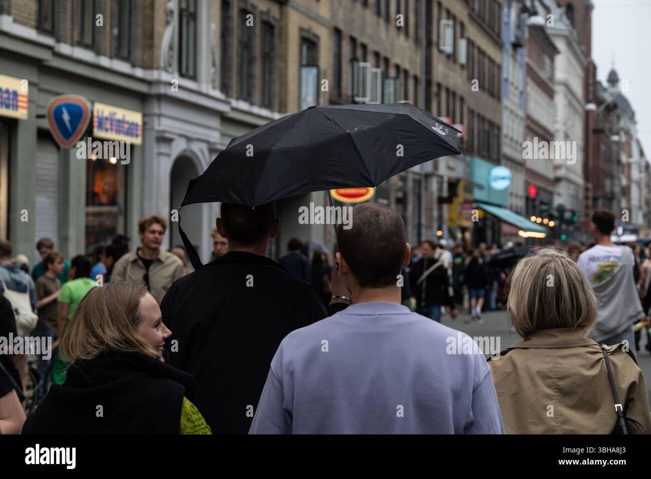 A reveller with an umbrella during Copenhagen Distortion 2025 in the ...