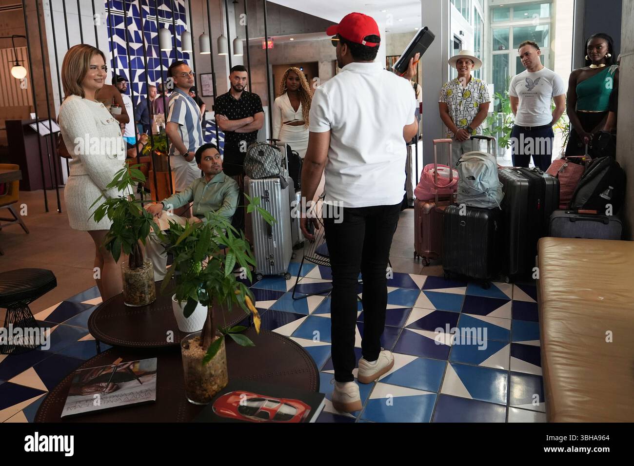 Bella Bautista, left, listens as Alan Hierro, center, addresses ...