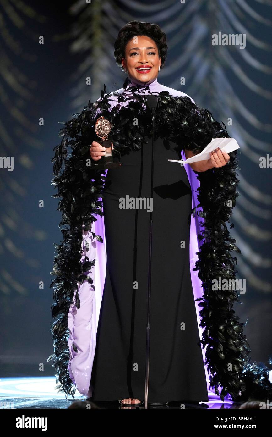 Natalie Venetia Belcon accepts the award for best performance by an ...