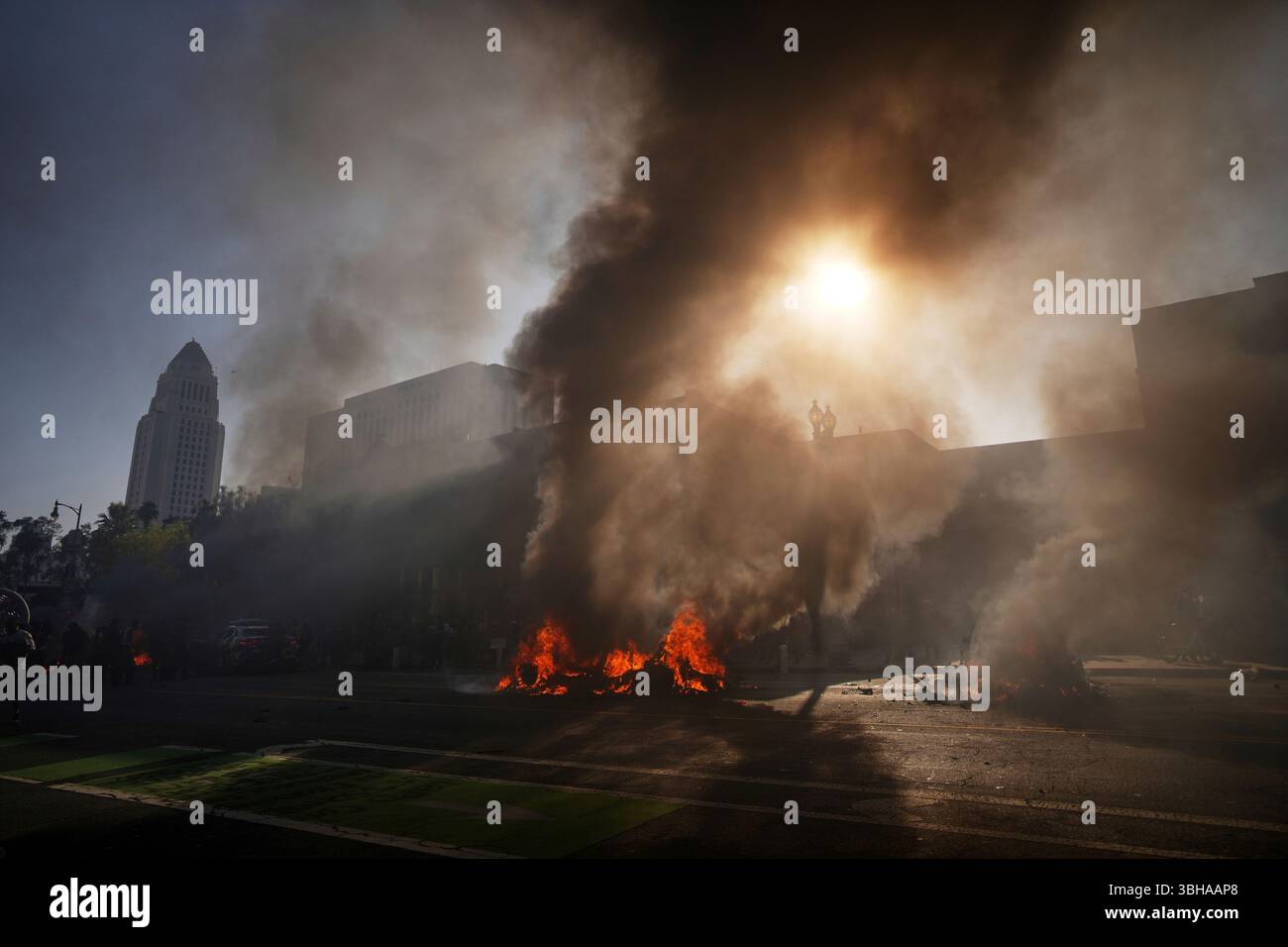 A Waymo taxi burns near the metropolitan detention center of downtown ...
