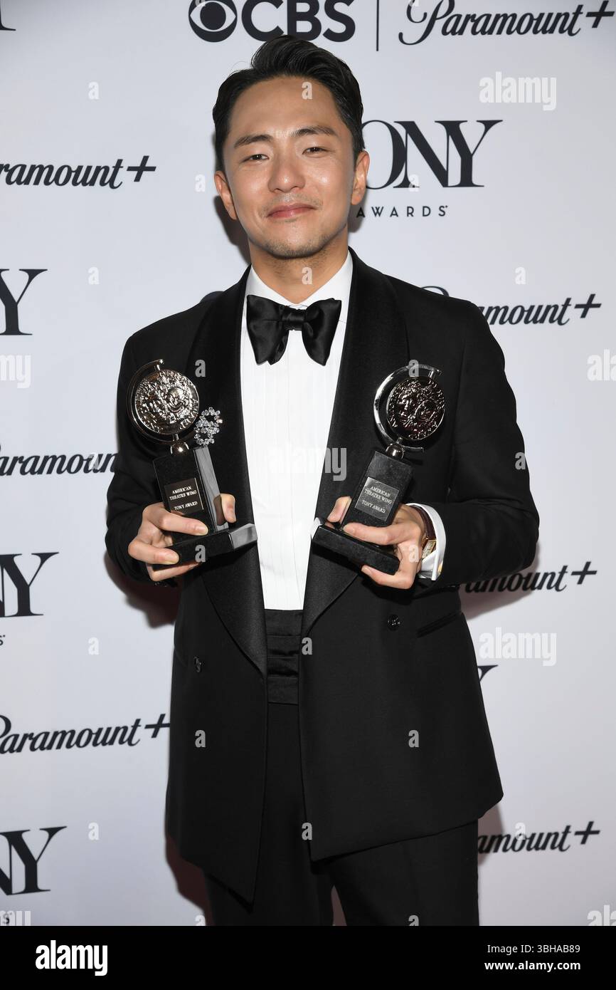 Hue Park poses in the press room with the awards for best original ...