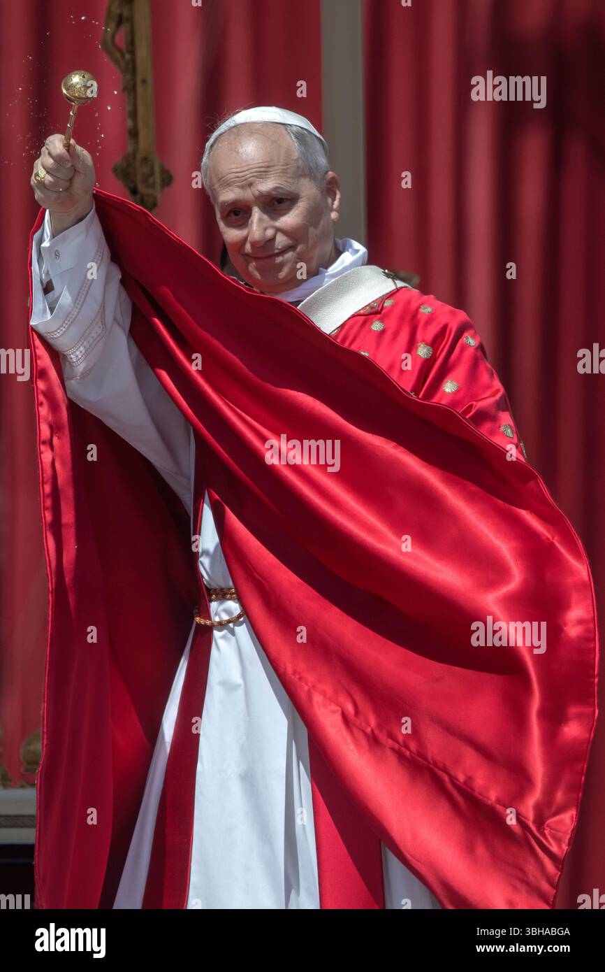Pope Leo XIV sprinkles holy water as he leads a Holy Mass on the ...