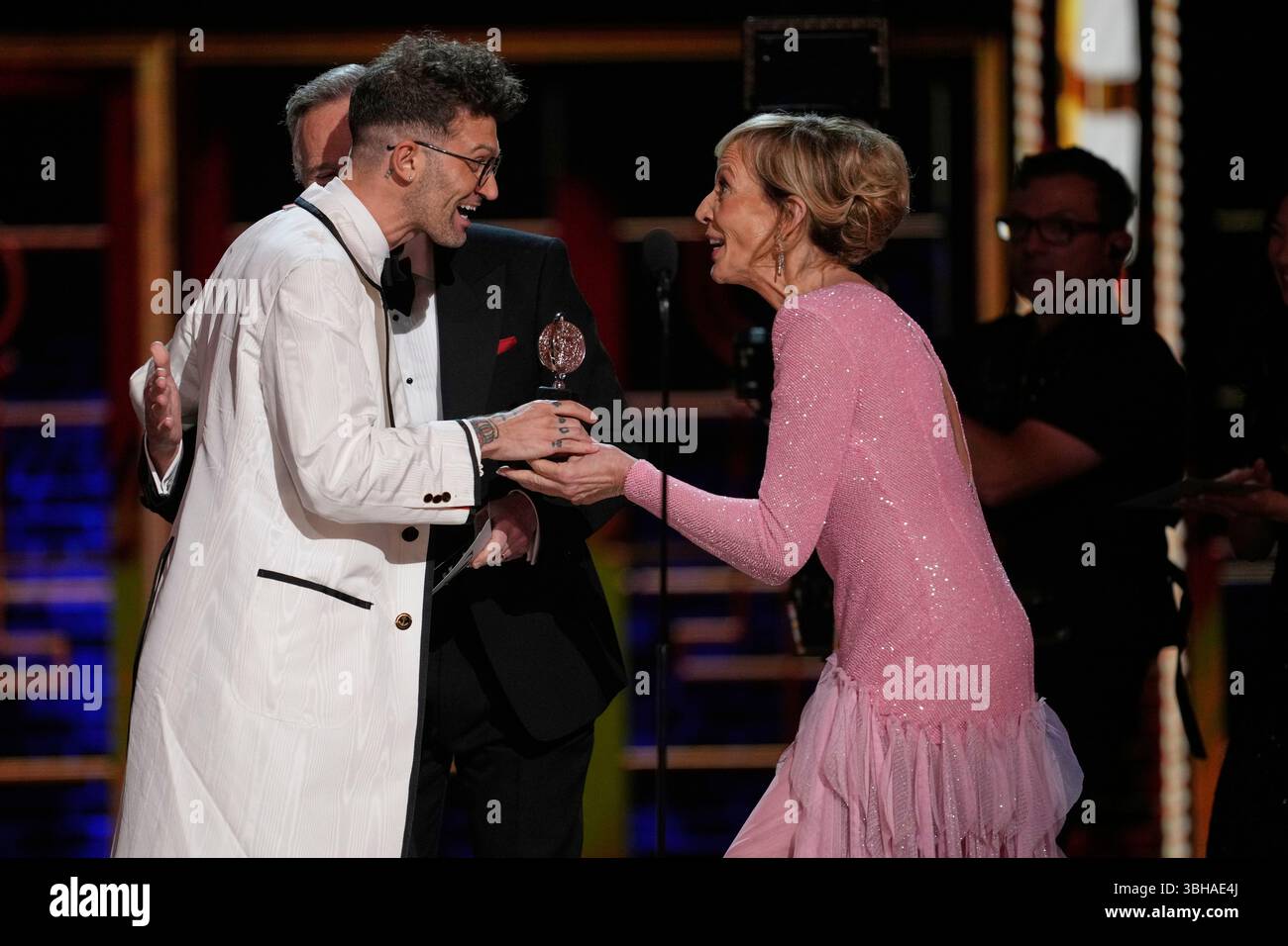 Allison Janney, right, presents the award for best direction of a play ...