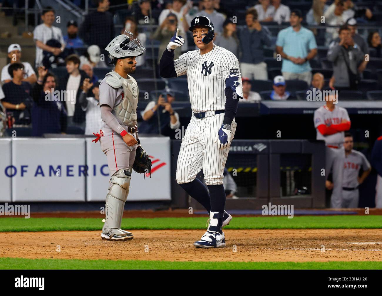 New York Yankees' Aaron Judge reacts at home plate after hitting a home ...