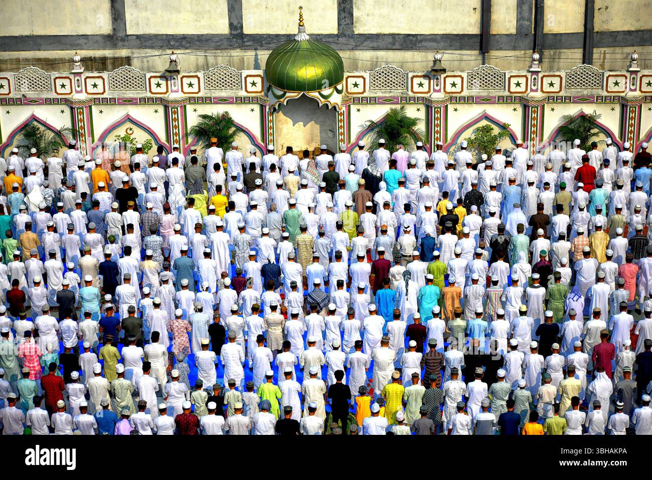 Muslim devotees offer prayers to their almighty during Eid-al-Adha ...